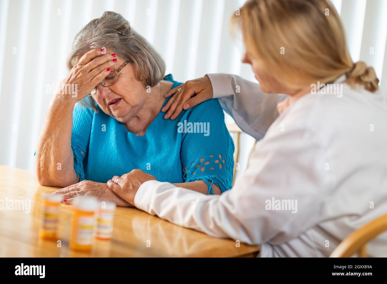 Doctor and distraught patient hi-res stock photography and images - Alamy