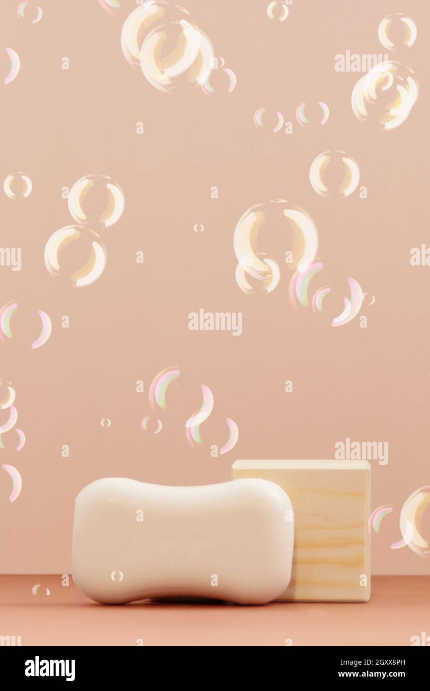 figured soap against beige background, hygiene and self care concept ...