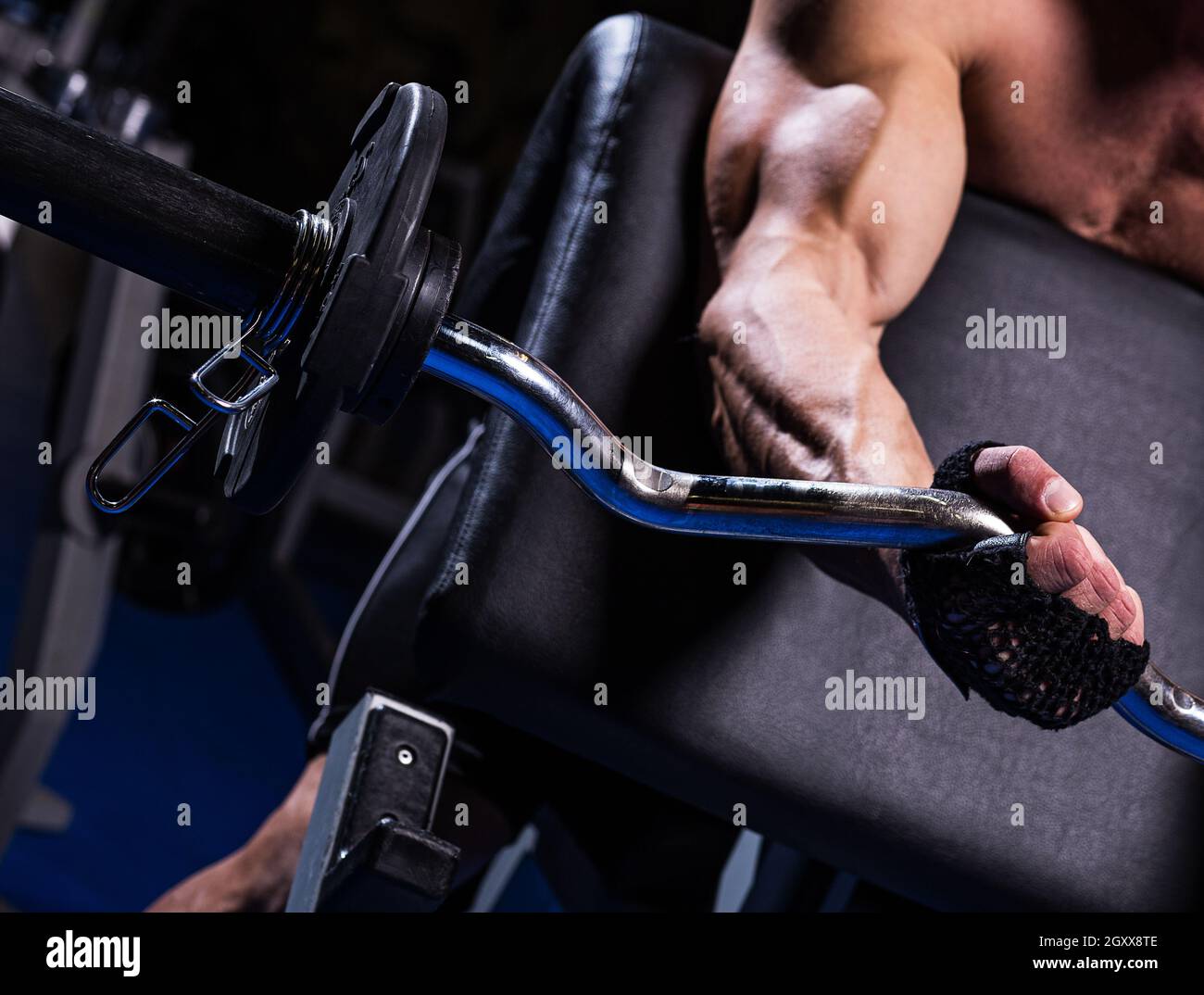 Close up of man hand during biceps exercise Stock Photo - Alamy