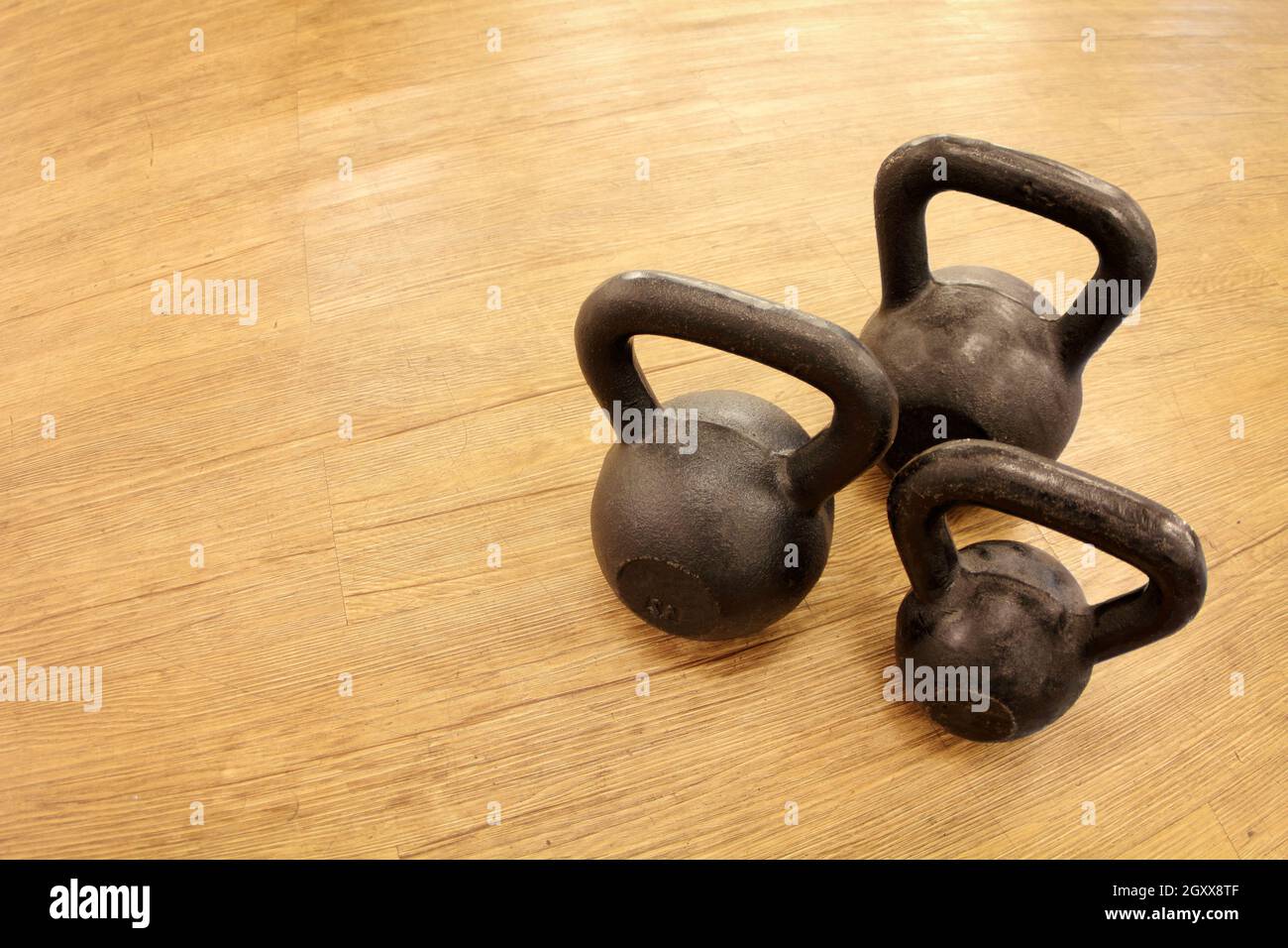 Kettlebell weights on the floor at the gym Stock Photo - Alamy