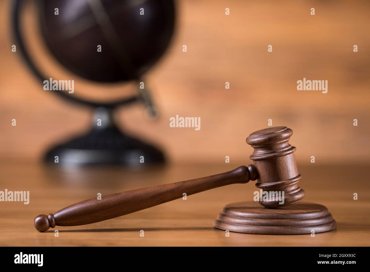 Law theme, mallet of judge, wooden gavel, globe background Stock Photo ...