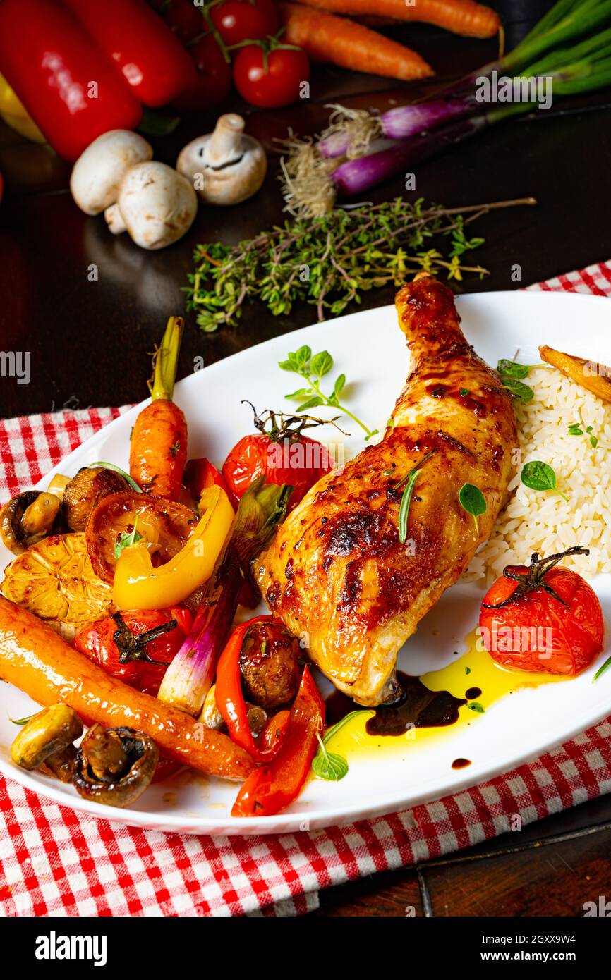 Rustic fried chicken legs with assorted vegetables and rice Stock Photo ...
