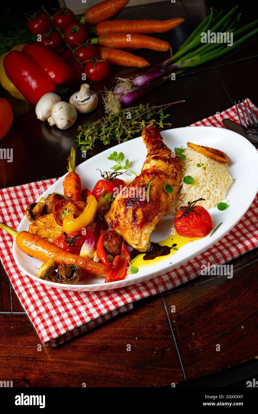 Rustic fried chicken legs with assorted vegetables and rice Stock Photo ...