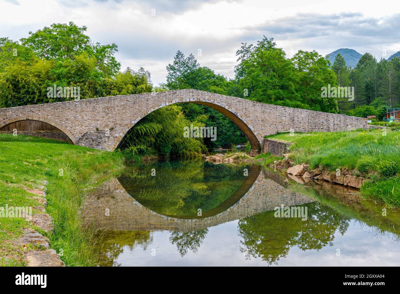 Medieval bridge over the Rialsesse river in Serres, France, located in ...
