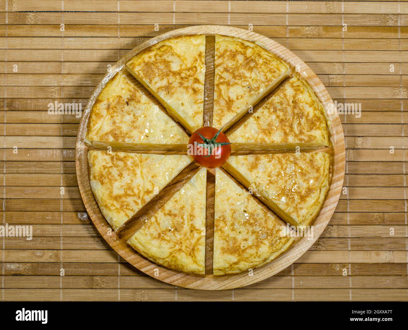 A triangle of potato Spanish omelette on a plate Stock Photo - Alamy