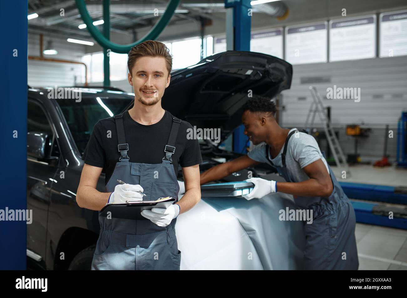 Male working car engine transportation automotive repairs hi-res stock ...