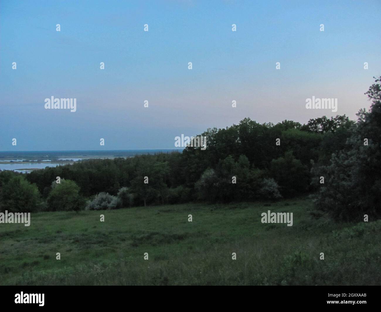 landscape: green trees and a river far away Stock Photo - Alamy