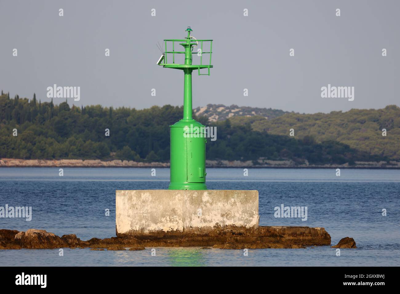 Small beacon at the pier in Croatia Stock Photo - Alamy