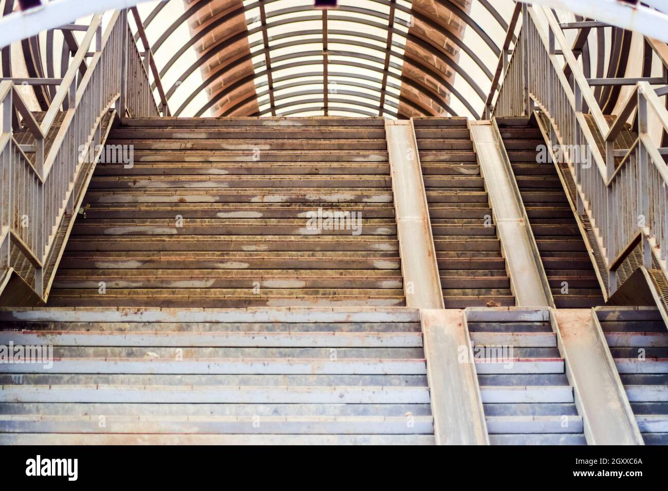Stairway in the air passage through the track. Overground crossing over ...