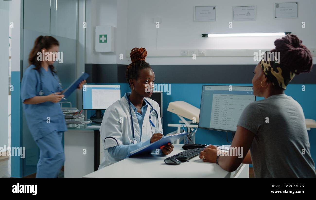 African american doctor and patient doing consultation for treatment ...