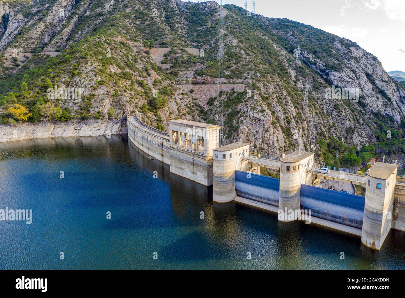 View of hydro-electric power station and a highway. Dam at Segre river ...