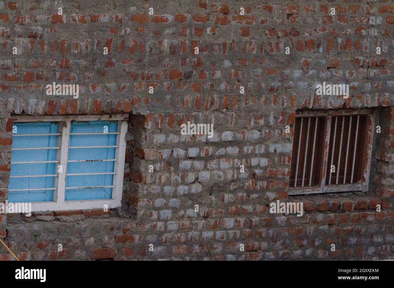 Isolated Wall with two different windows Stock Photo - Alamy