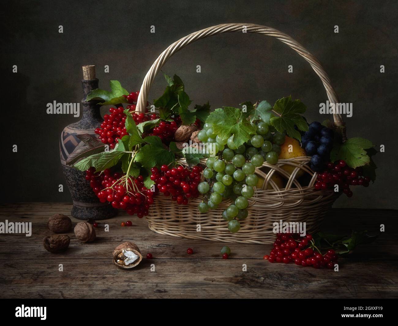 Still life with basket of fruits Stock Photo - Alamy