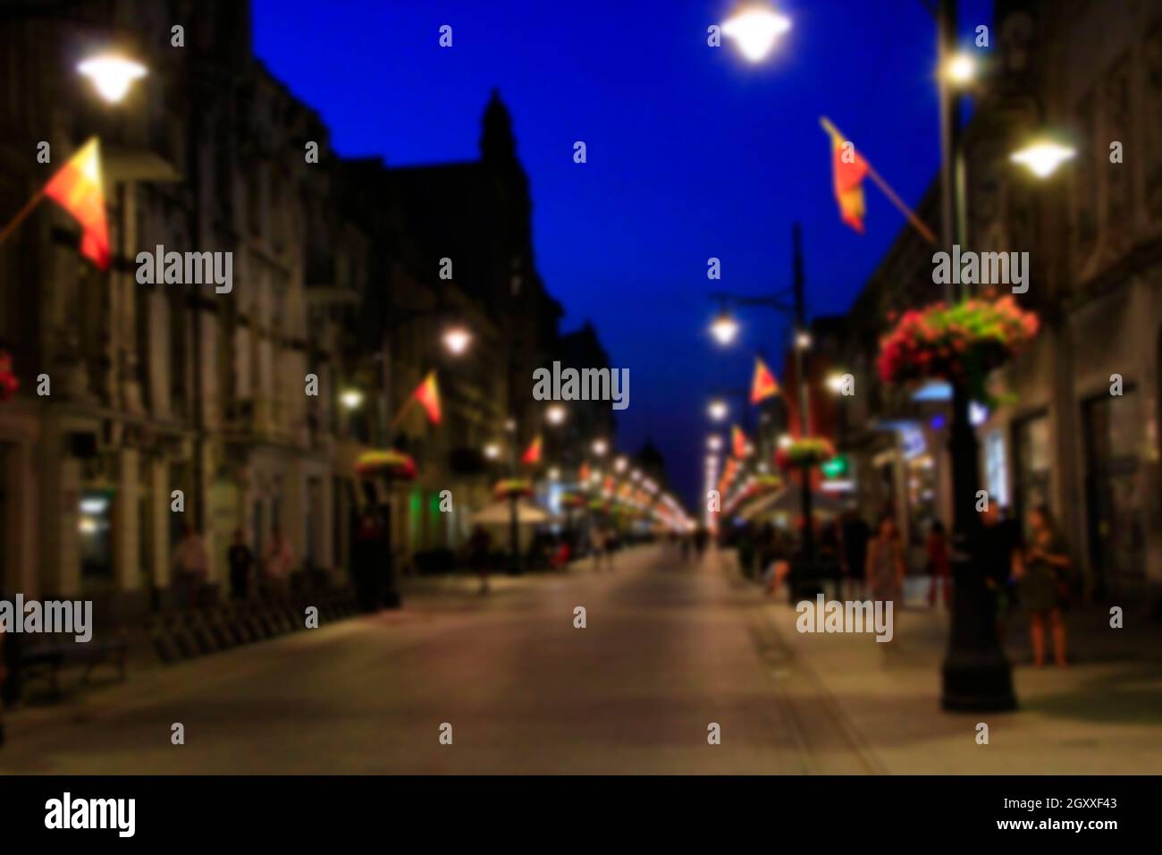 Light illumination in city blurred. Night street with illuminated ...