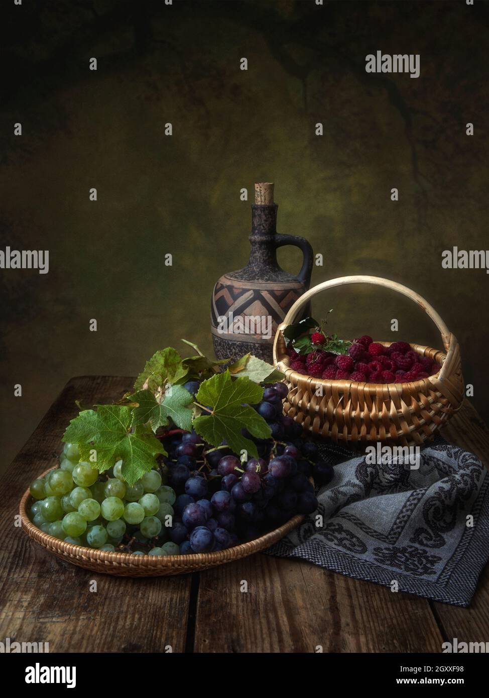 Still life with grapes and raspberry Stock Photo - Alamy