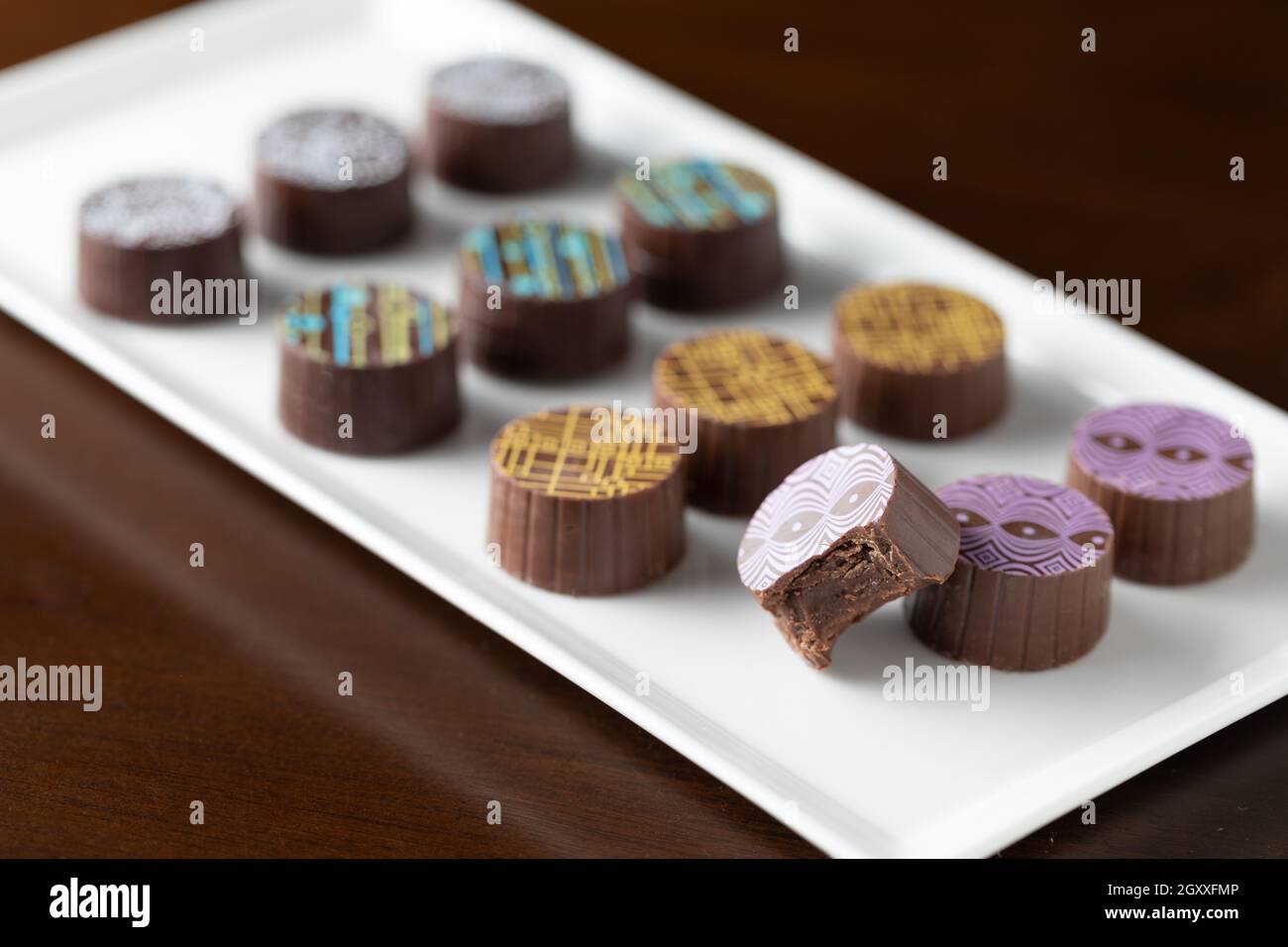 Artisan Fine Chocolate Candy On Serving Dish Stock Photo - Alamy