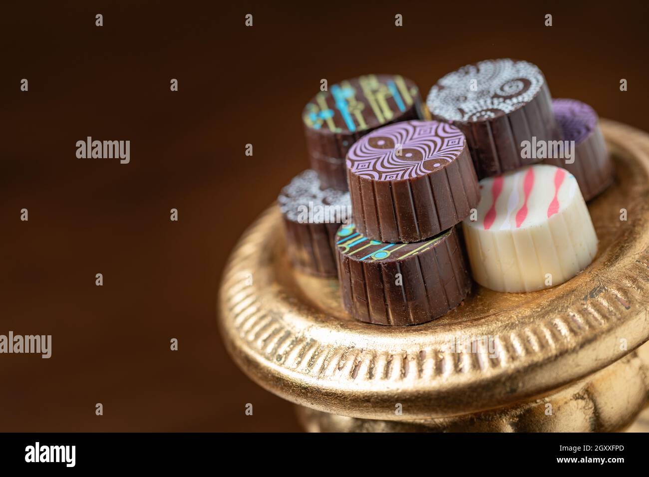 Artisan Fine Chocolate Candy On Gold Pillar Serving Dish Stock Photo ...