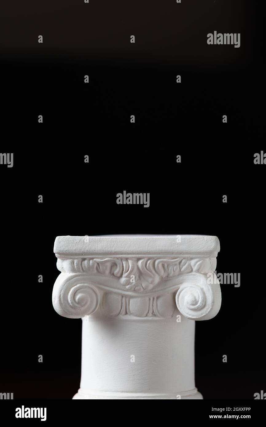 White Ionic Design Column on Dark Background Stock Photo - Alamy