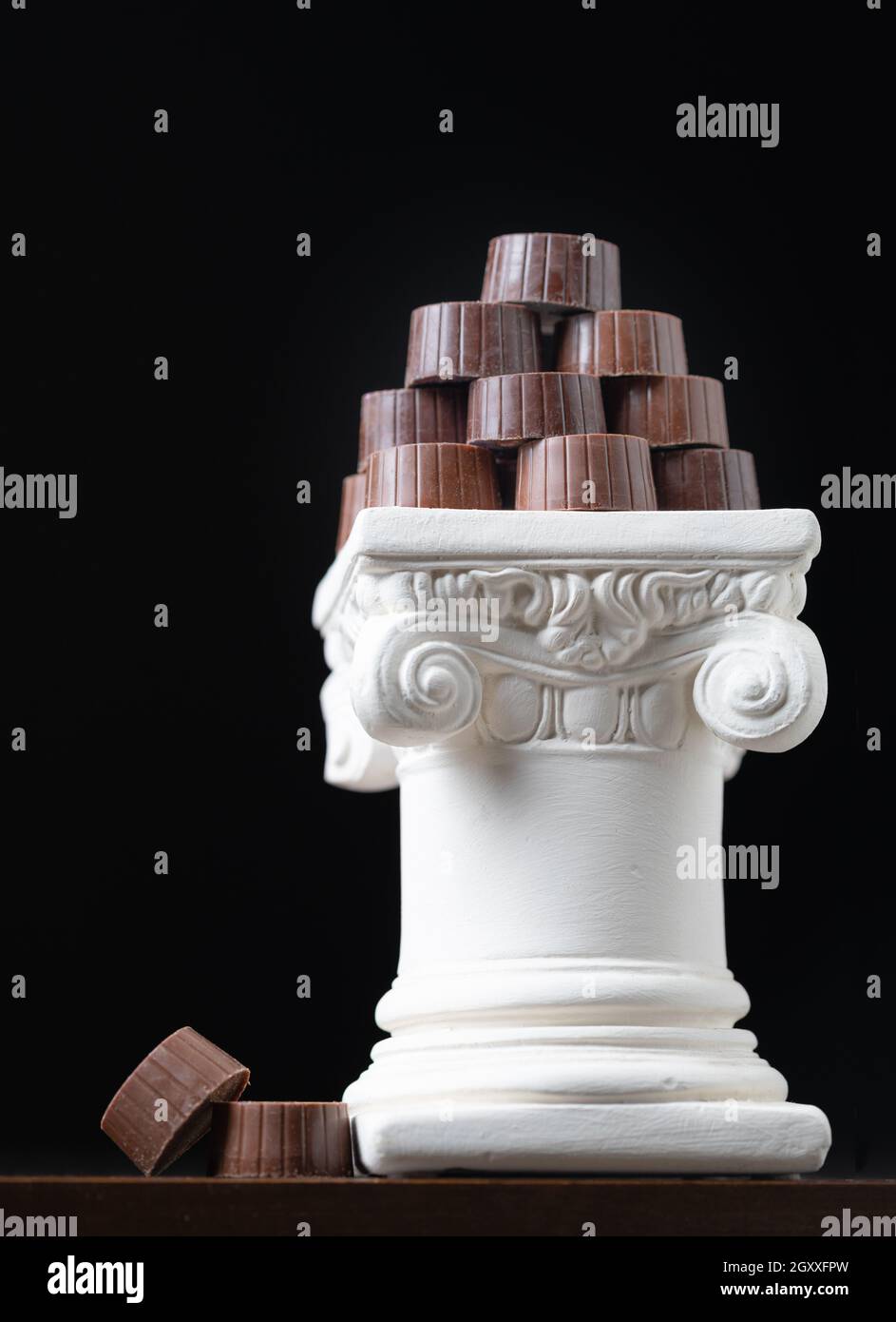 Stack of Fine Artisan Chocolates Stacked On White Pillar Column Stock ...