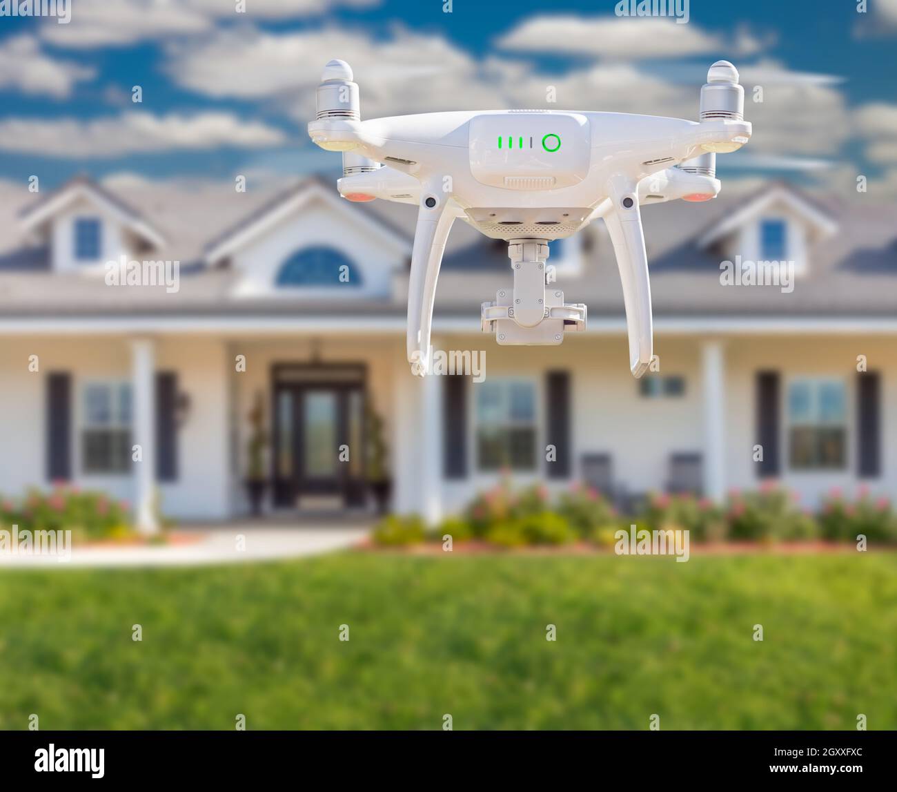 Back of Unmanned Aircraft System (UAV) Quadcopter Drone Flying In Front ...