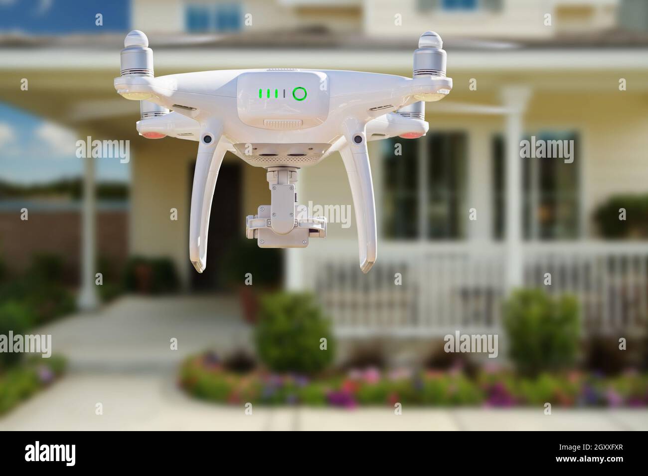 Back of Unmanned Aircraft System (UAV) Quadcopter Drone Flying In Front ...