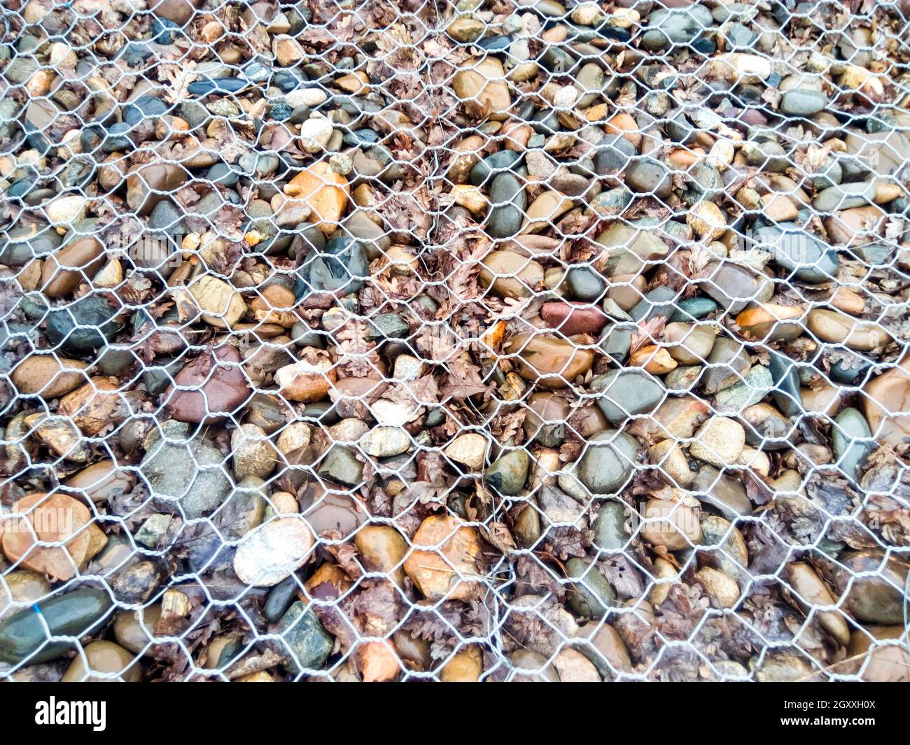 Retaining net on the slope. The net keeps the pebble from scattering ...
