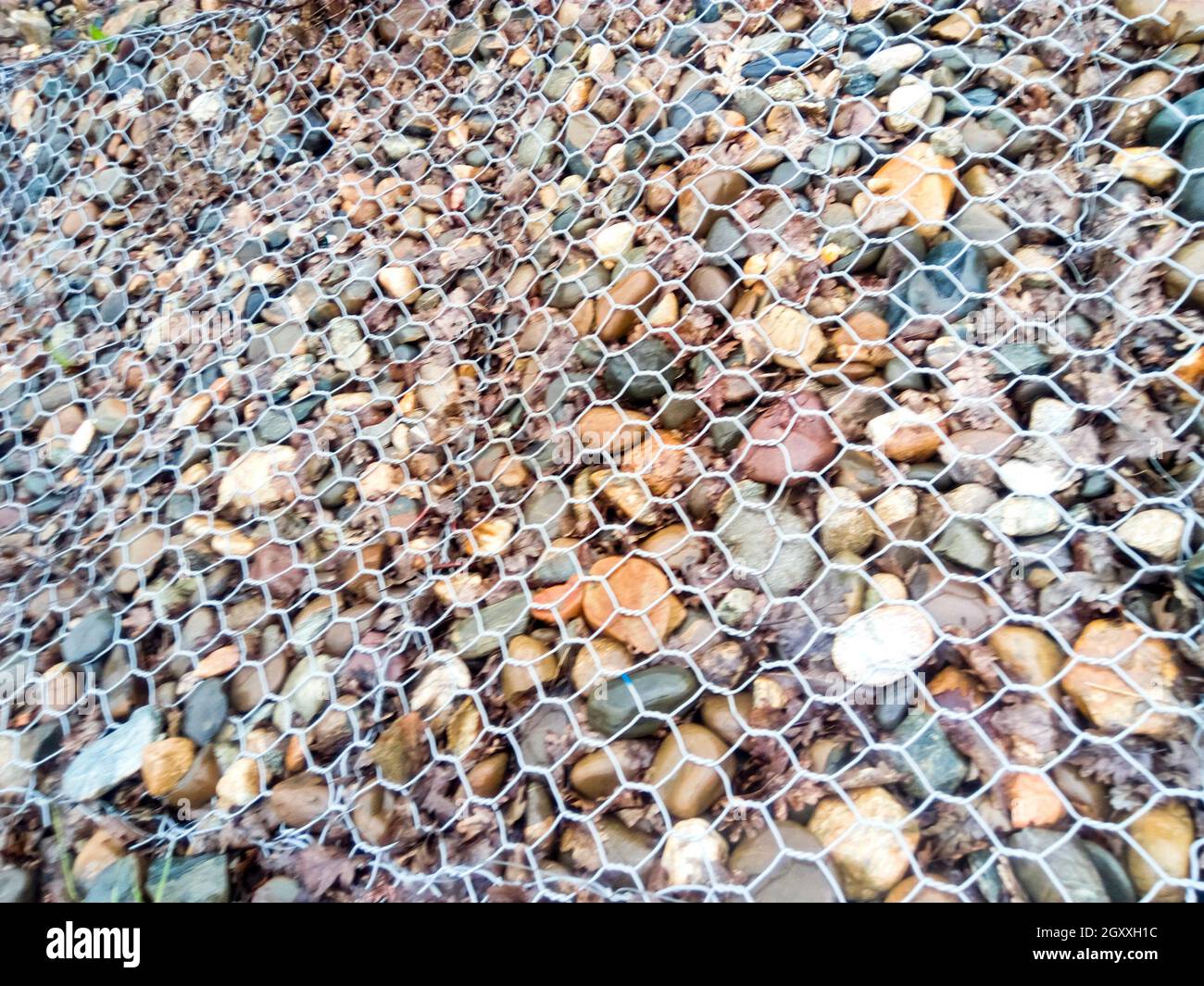 Retaining net on the slope. The net keeps the pebble from scattering ...