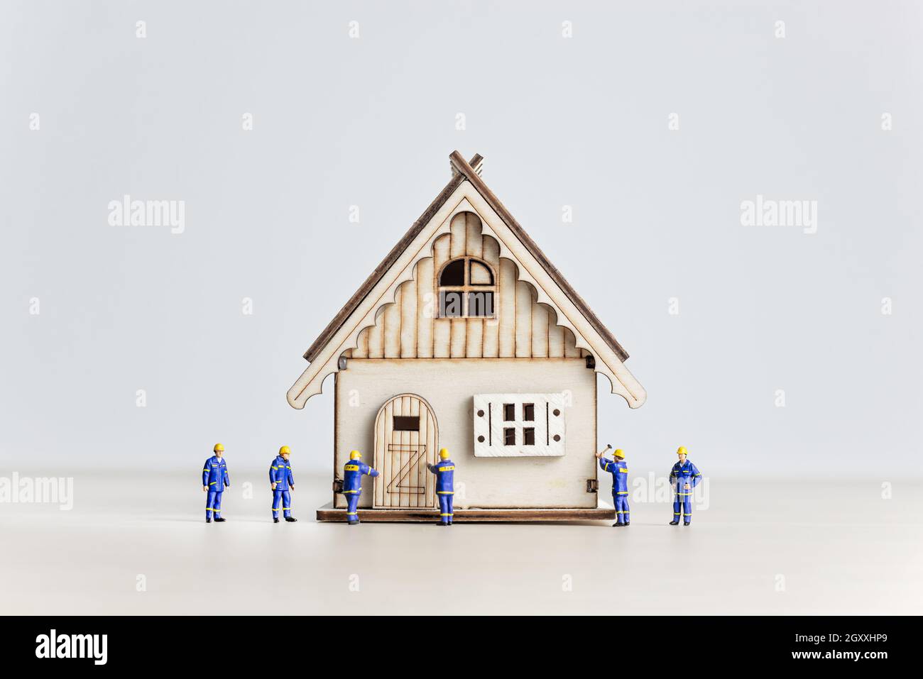 Figurines of builders working on the house. Developing concept Stock ...