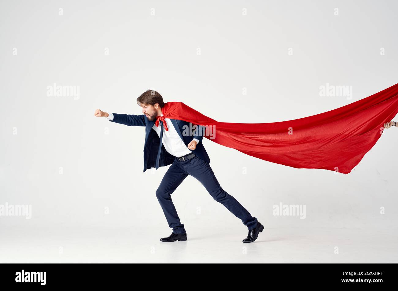 business man in red cloak protecting the city superhero work Stock ...