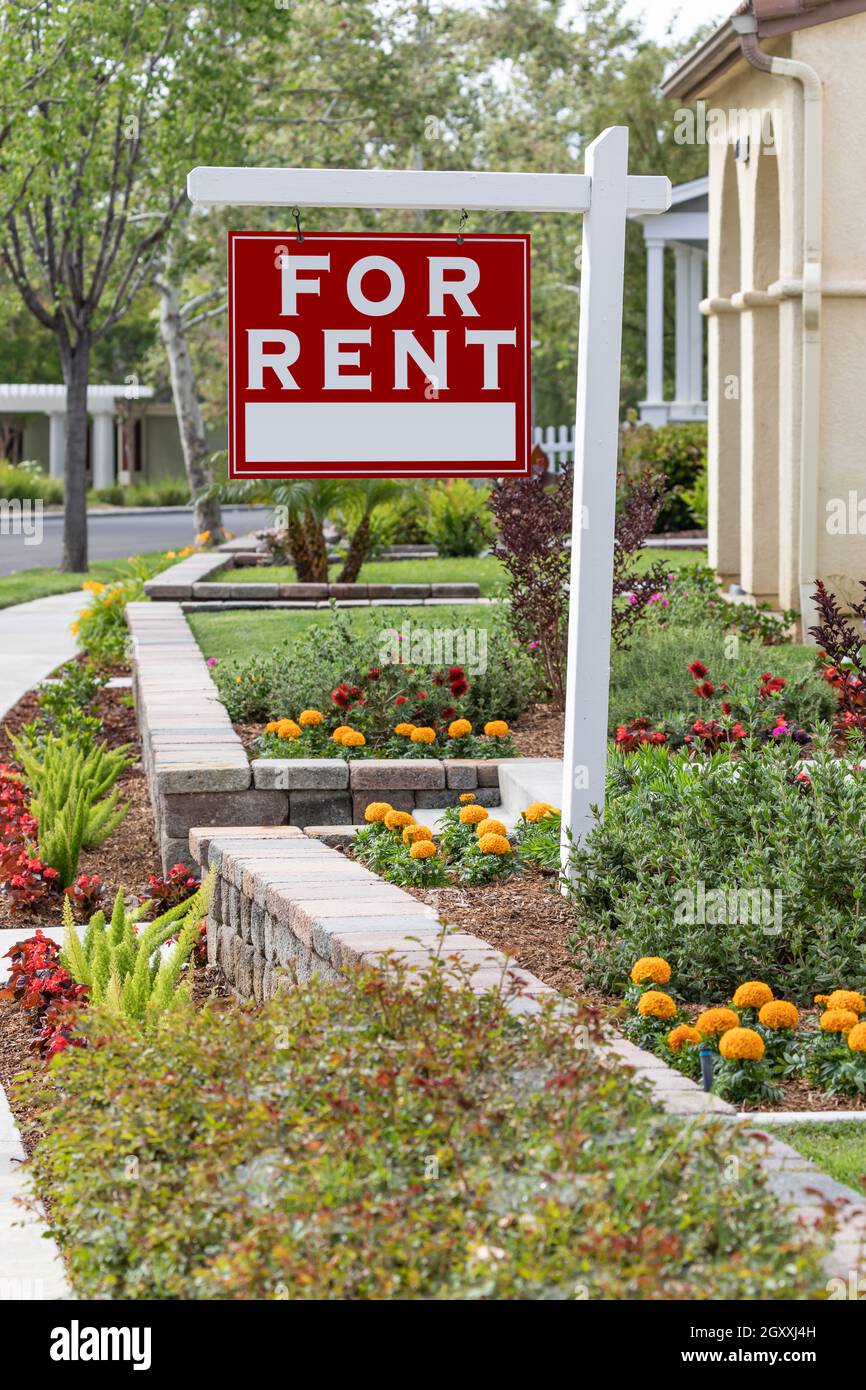 Red For Rent Real Estate Sign in Front House Stock Photo - Alamy