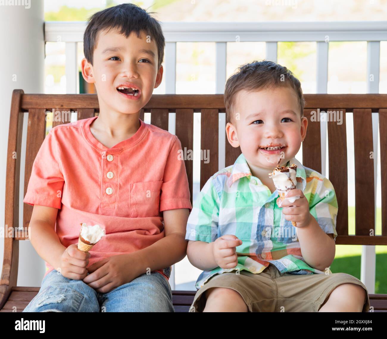 Two ethnic brothers eating hi-res stock photography and images - Alamy
