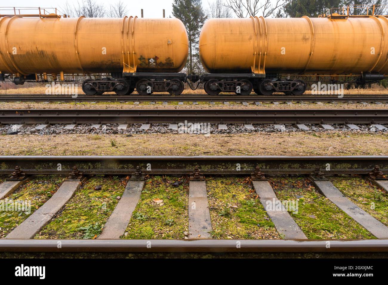Oil transporter railway carriage. Train delivering gasoline in tanks ...