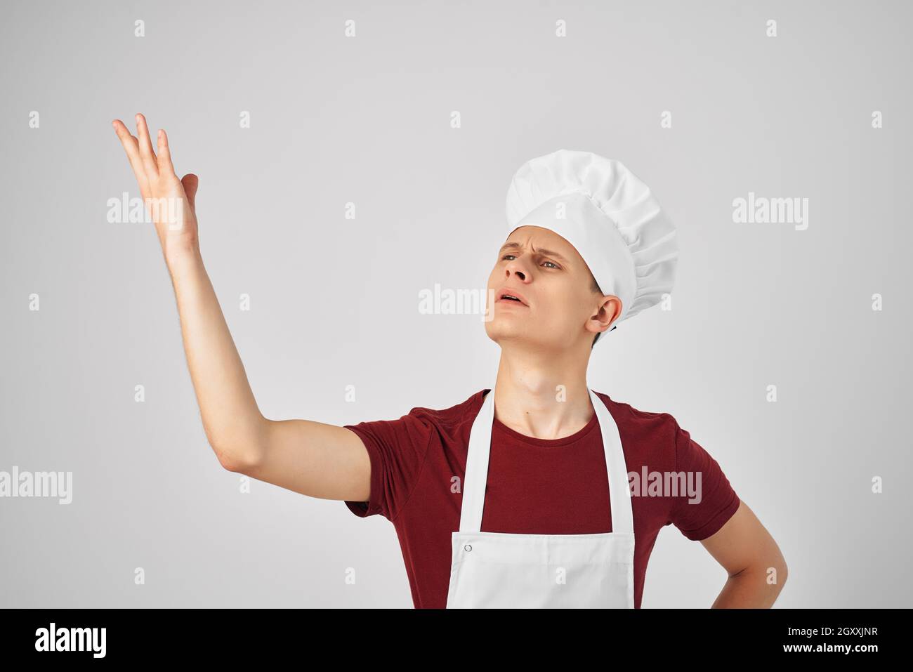 male chef with a cap on his head kitchen work Stock Photo - Alamy
