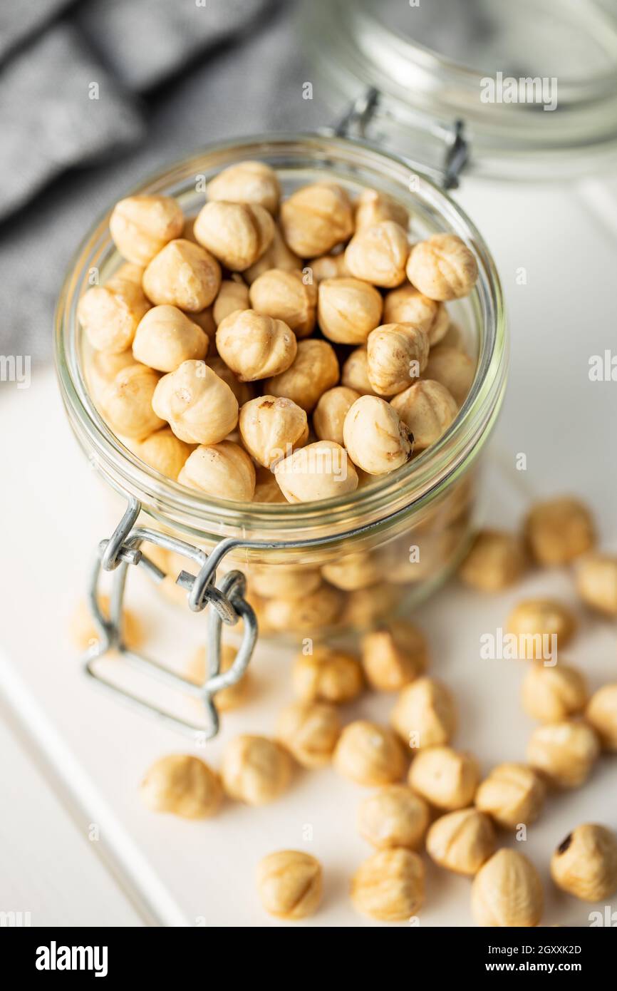 Peeled roasted hazelnut kernels in jar Stock Photo - Alamy