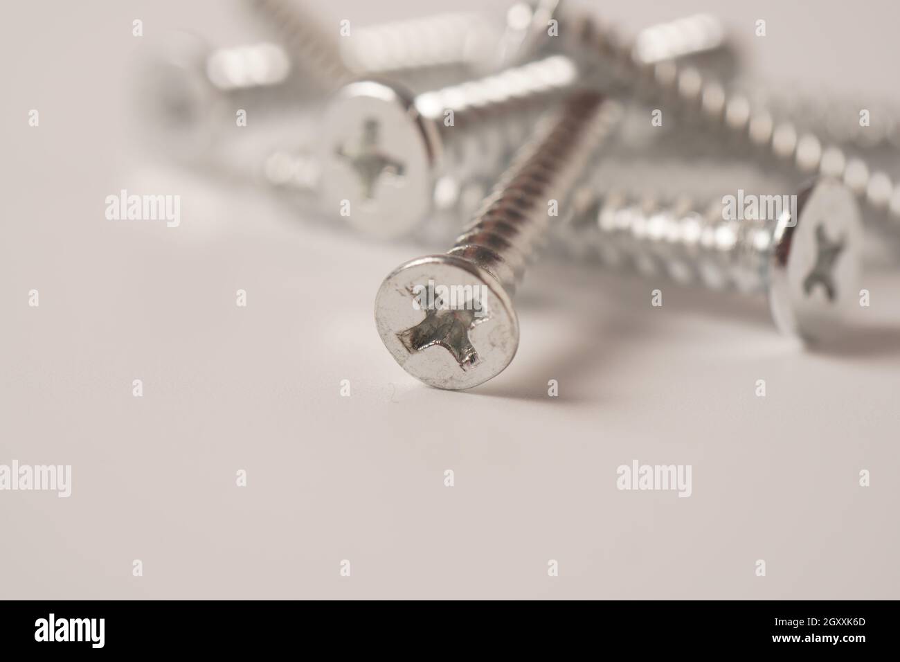Tapping screws made of steel, metal screws, iron screws isolated on ...
