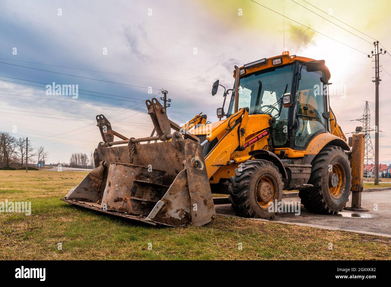 Excavator loader in a parking lot for road transport. A wheeled vehicle ...