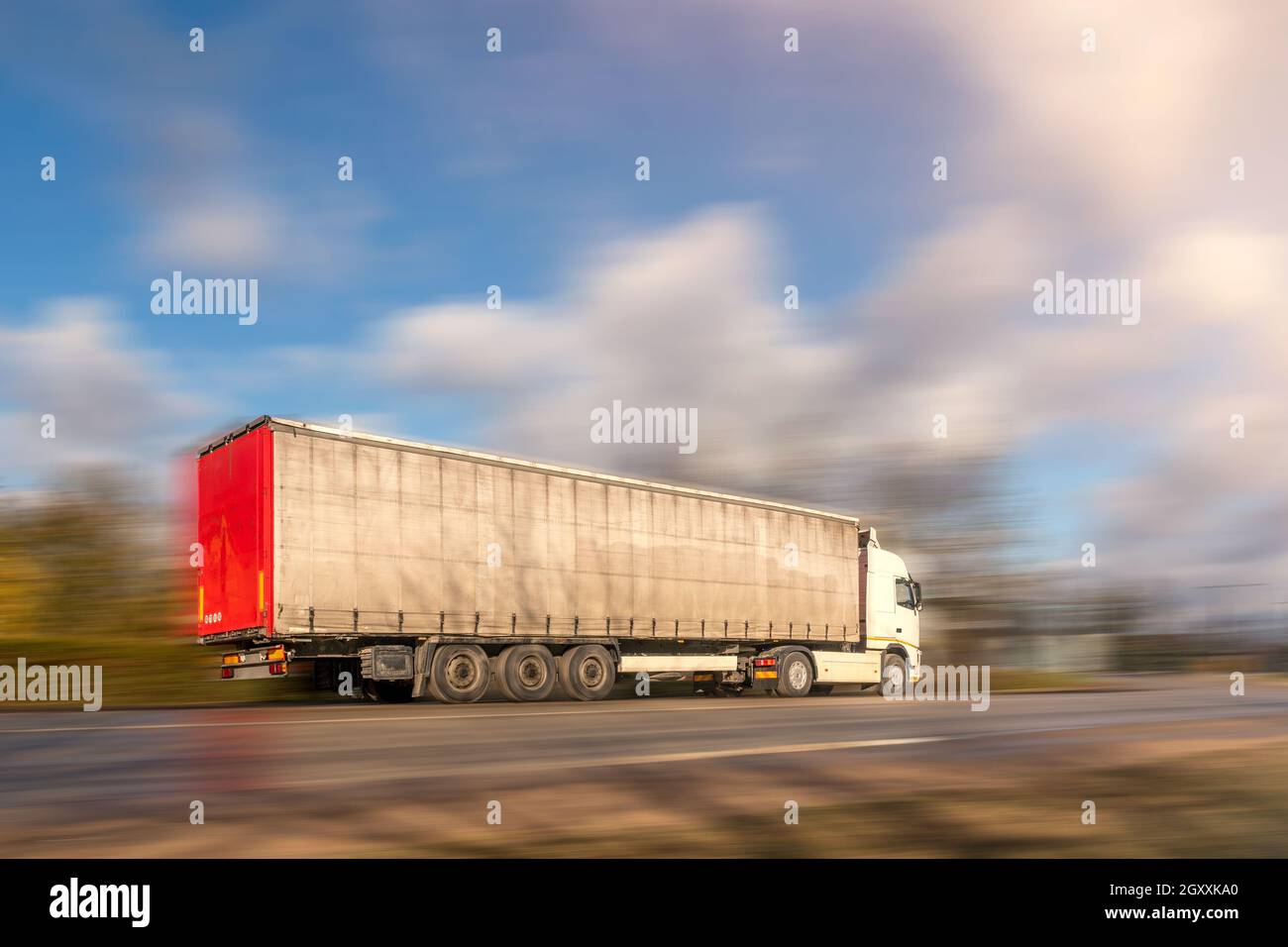 Truck on asphalt road motion blur. Truck with container on highway ...