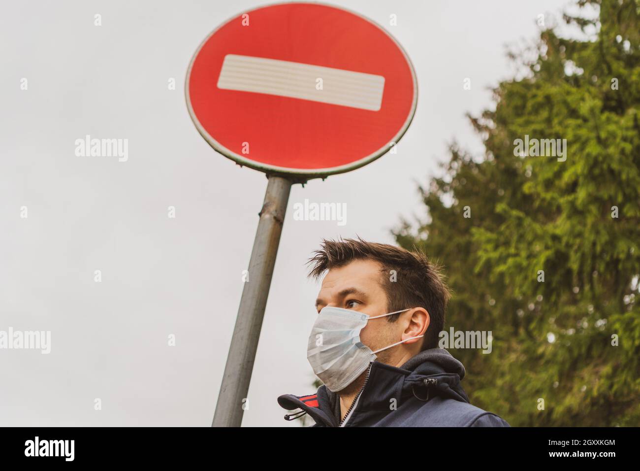 Man wearing facial hygienic mask. Ecology, air pollution car ...