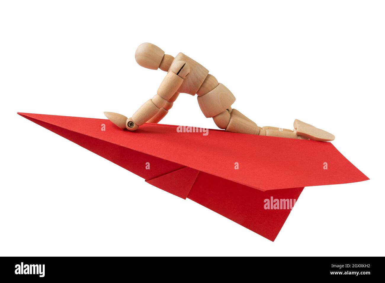 Wooden doll flying on a paper plane. Isolated on white background Stock ...