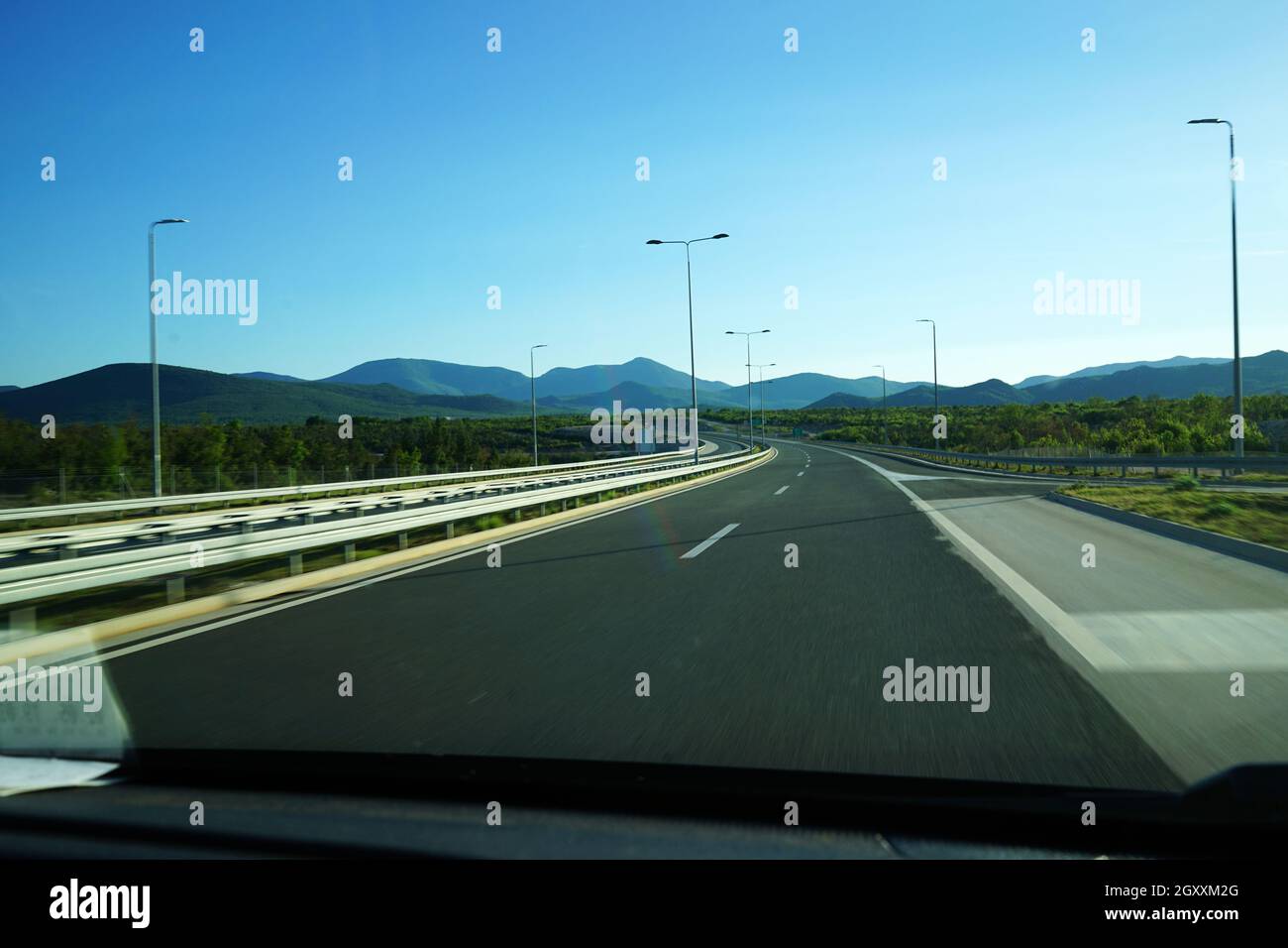 Beautiful roadside landscape scenery with mountain range and clear blue ...