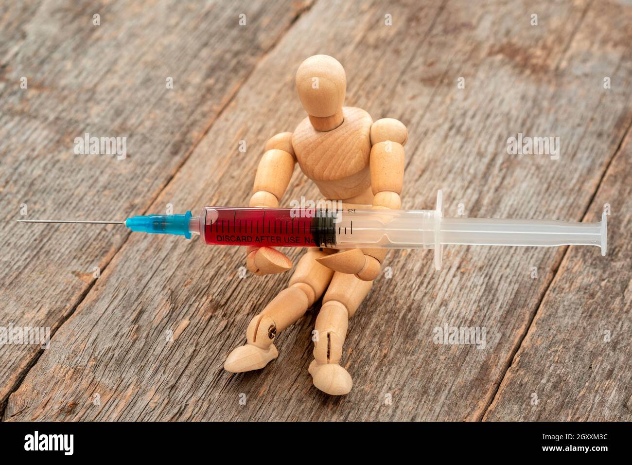 Syringe, medical injection in a doll hands. Medicine plastic ...