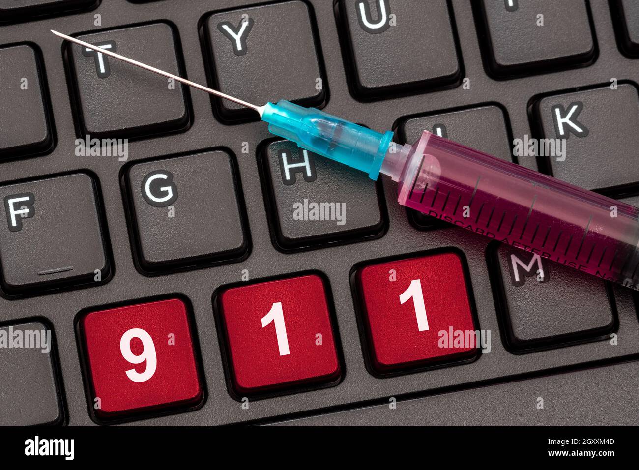 Computer keyboard with syringe and emergency number 911 Stock Photo - Alamy
