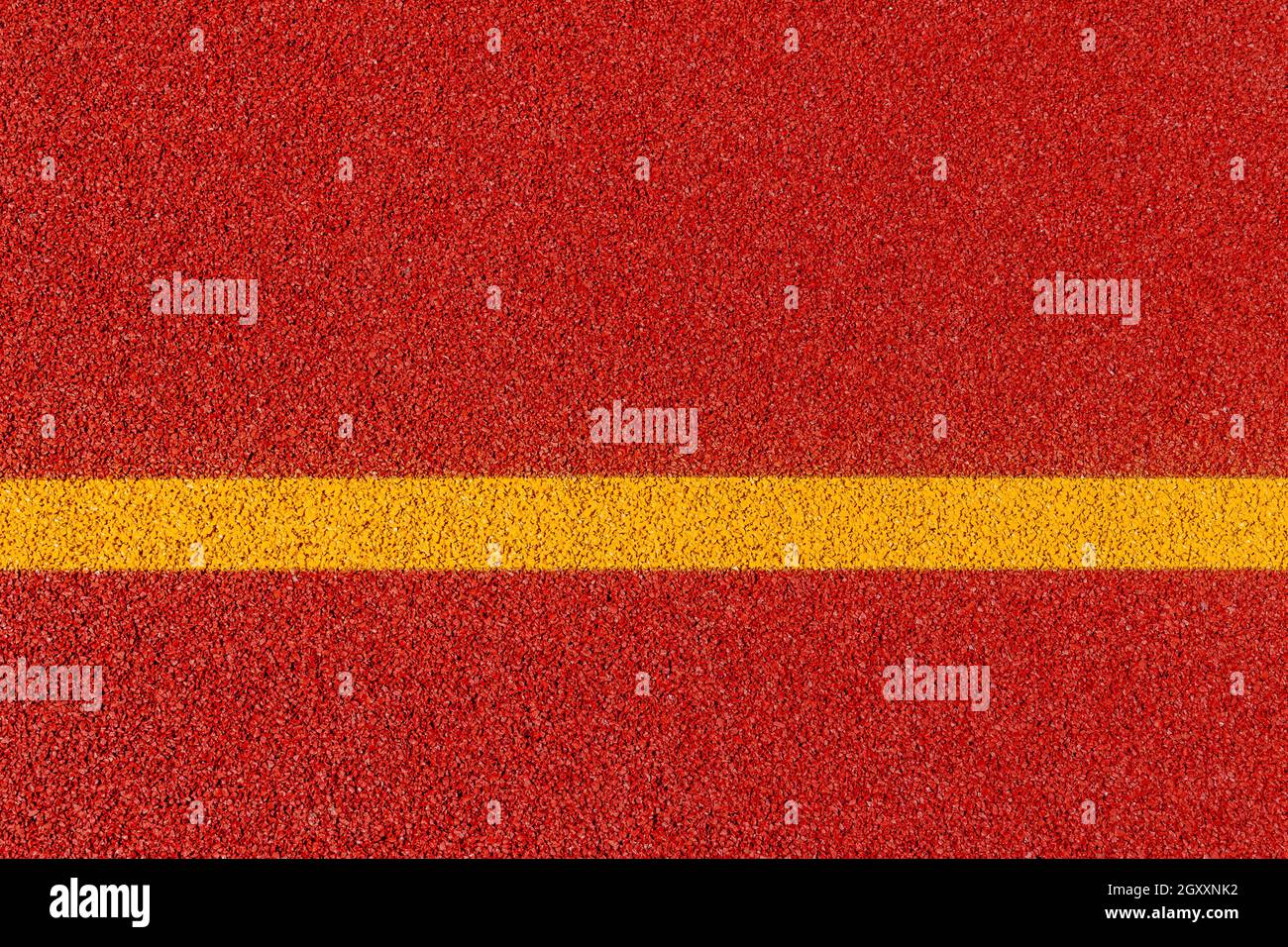 Single yellow line in running court athlete stadium, top view, rubber ...