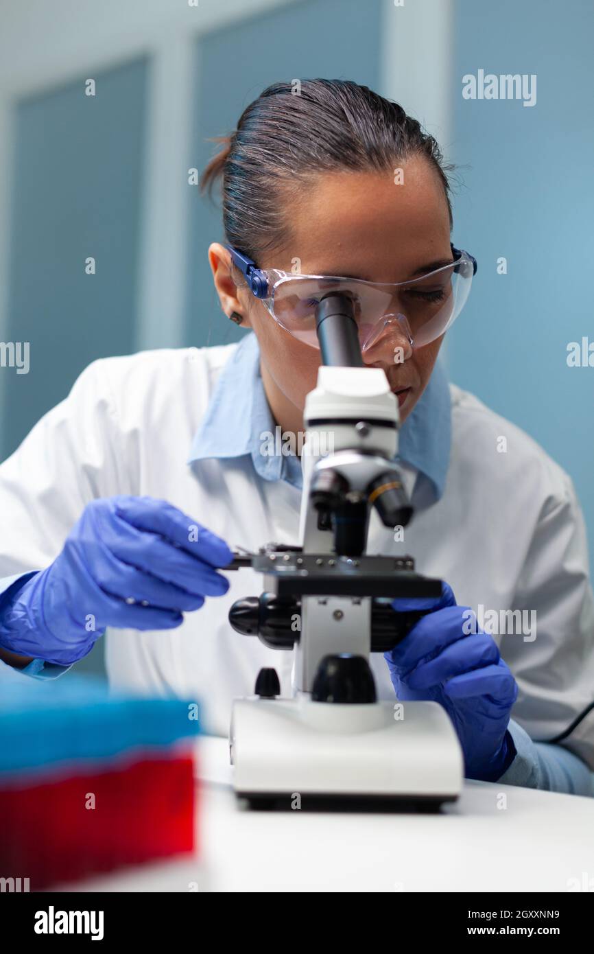 Scientist using magnifying glass microscope hi-res stock photography ...