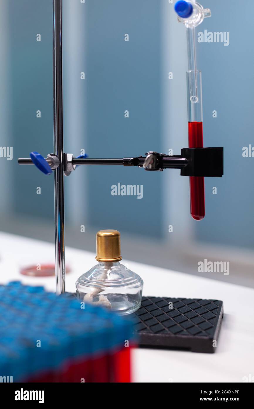 Chemical dripping pipe with test tube in science laboratory at clinic ...