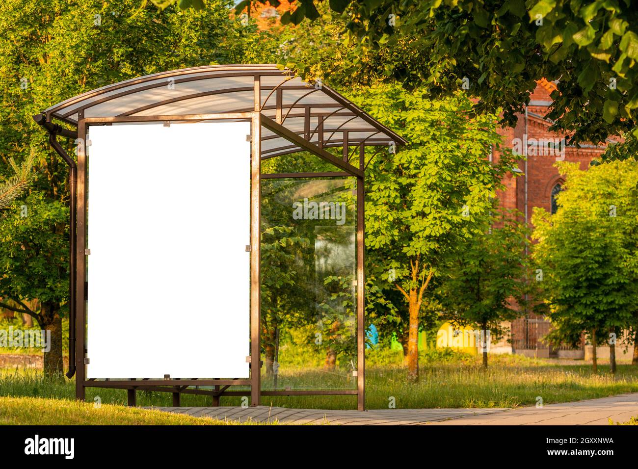 Blank white mockup of bus stop vertical billboard in front of nature ...