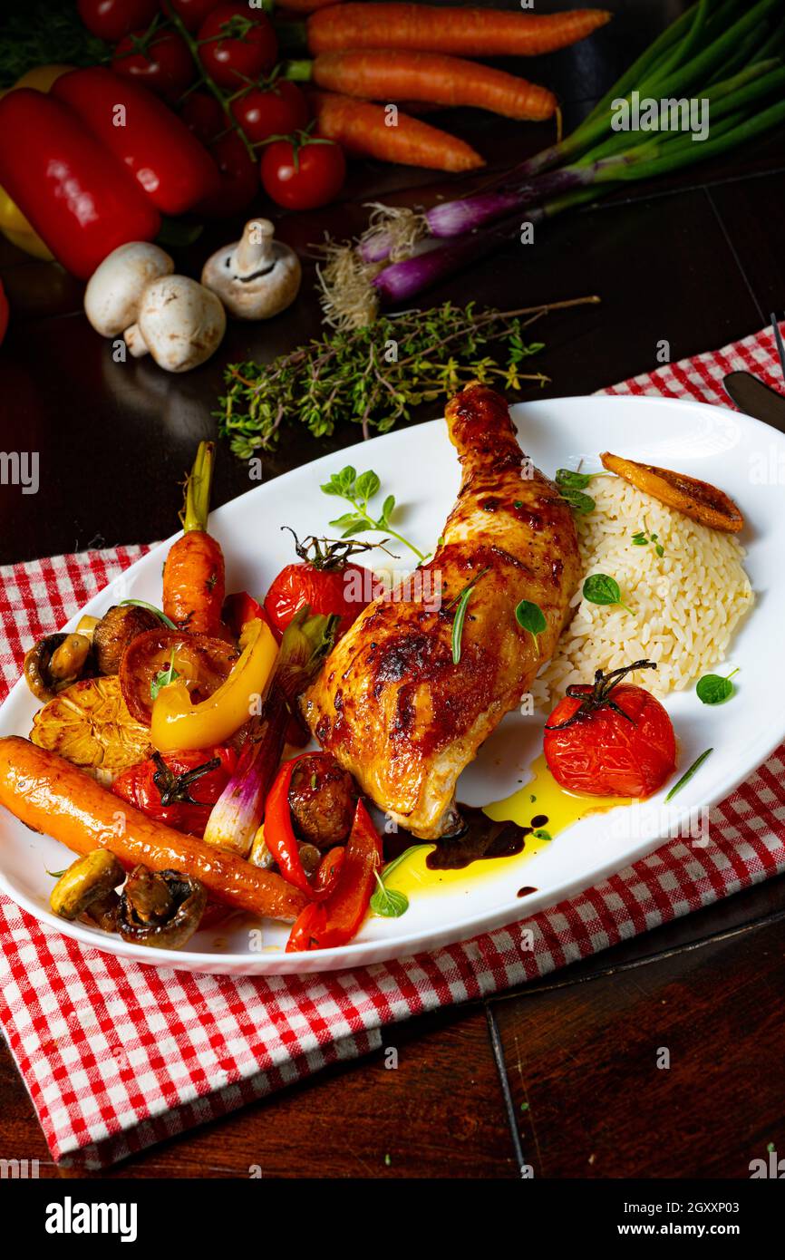 Rustic fried chicken legs with assorted vegetables and rice Stock Photo ...