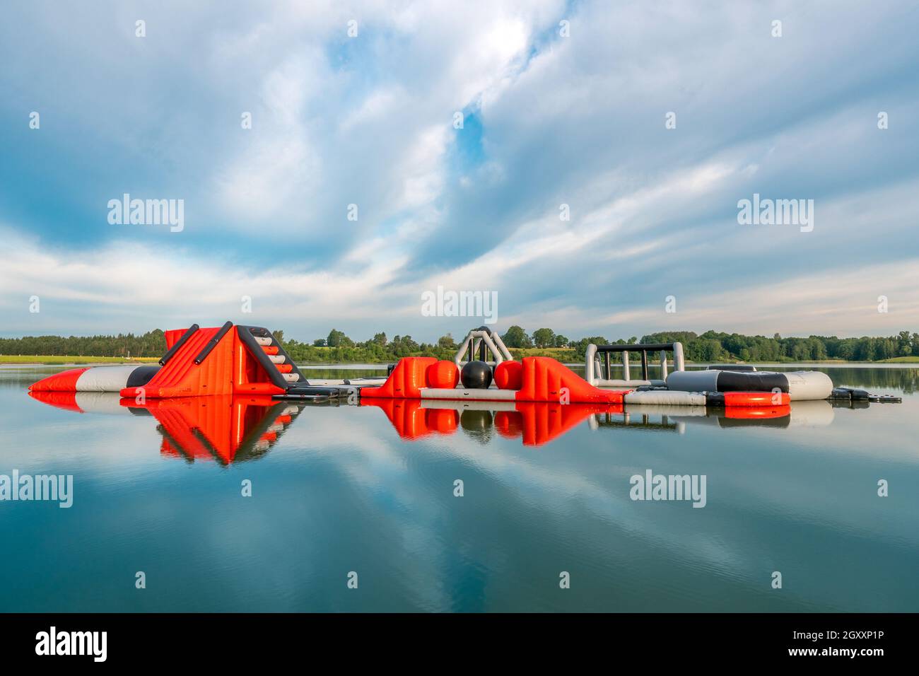 Water bouncy park. The inflatable floating assult course at lake Stock ...