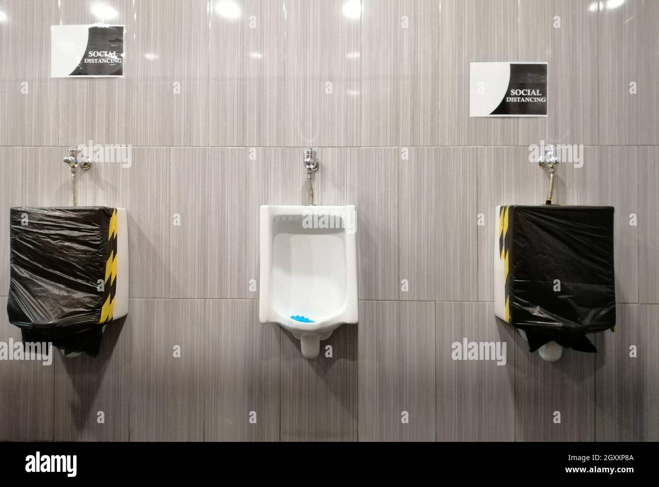 Public men toilet during Corona virus pandemic. New normal that people ...