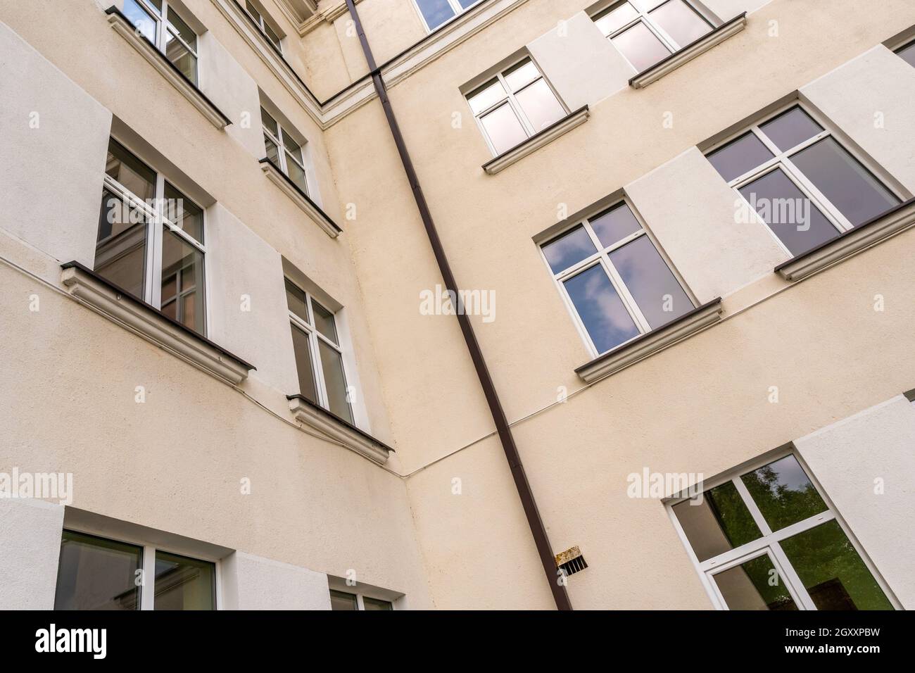 Facade of the old multistory residential building. Front view of the ...